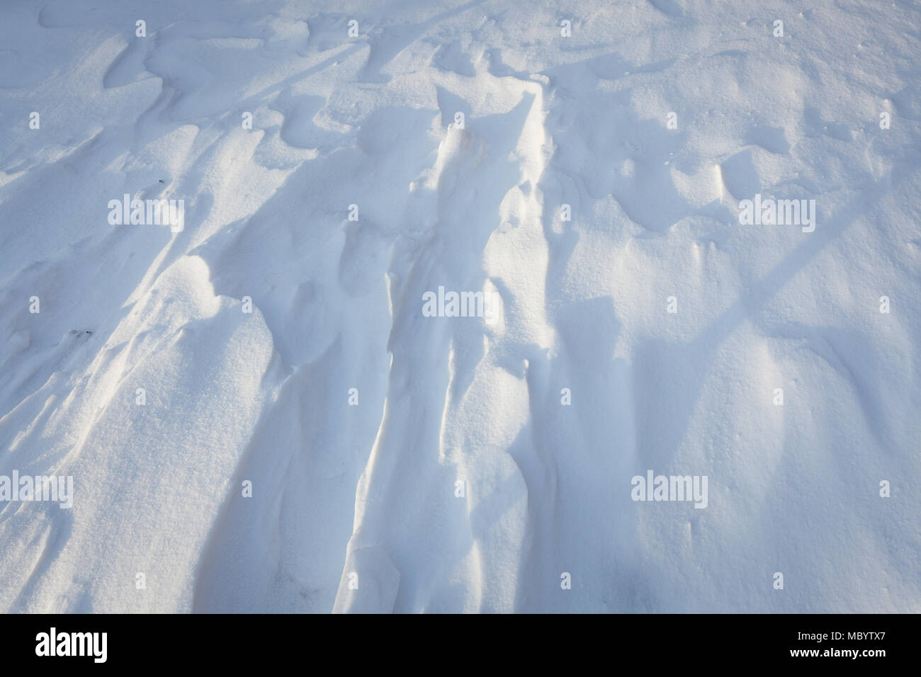 Wind patterns in snow Stock Photo - Alamy