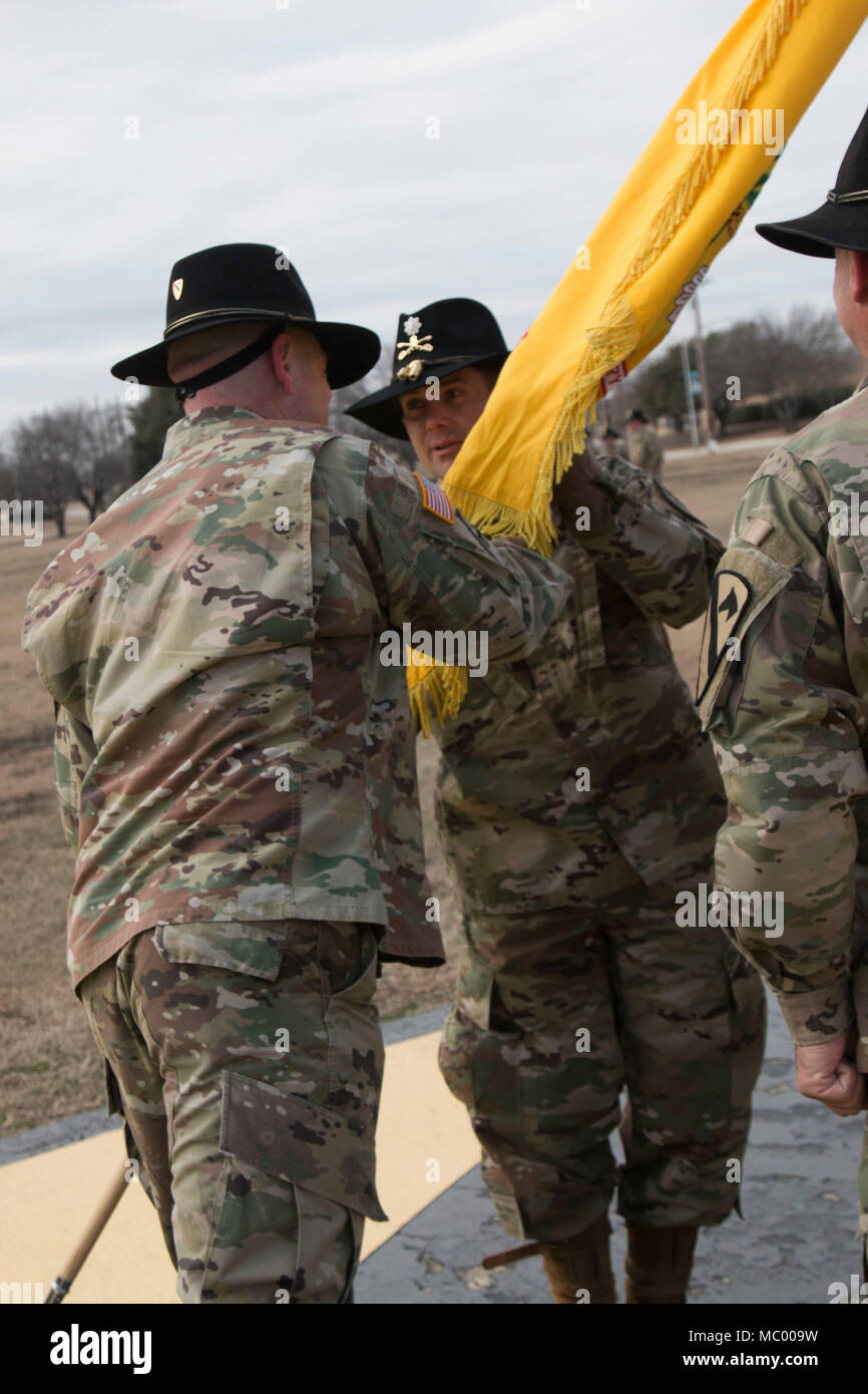 Incoming Commander Lt. Col. Kevin Black accepts the guidon from ...