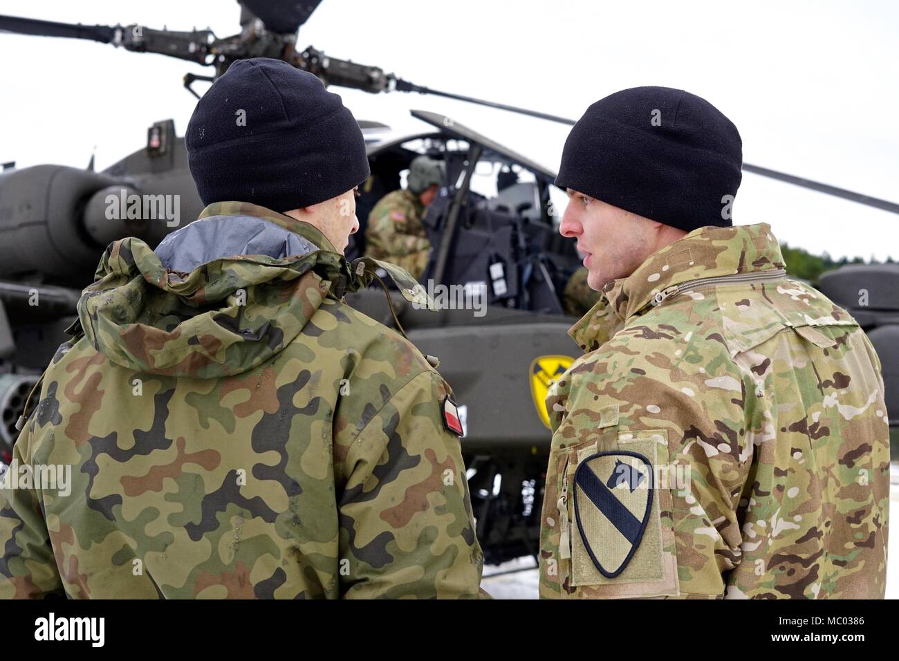 First Lieutenant Ethan Gleue (right), an AH-64 Apache helicopter pilot ...