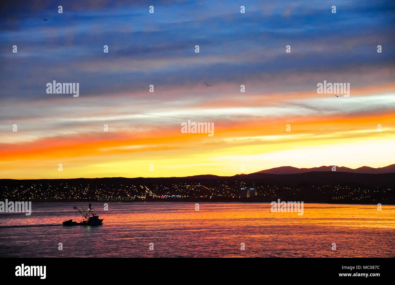 Fiery orange sunrise over Monterey, California. Beautiful dawn sky ...