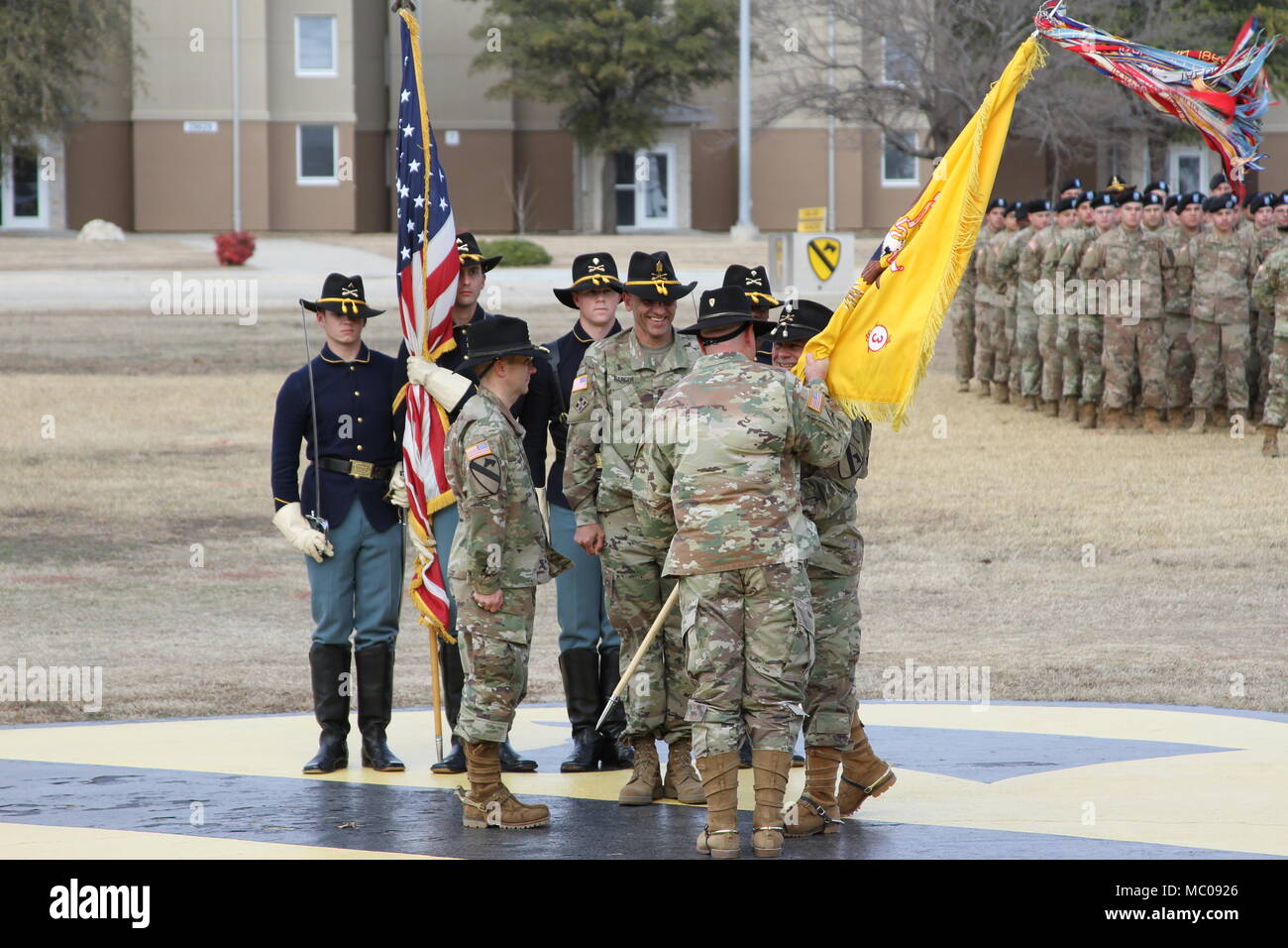 Outgoing Commander Lt. Col. Brian McCarthy passes the guidon to ...