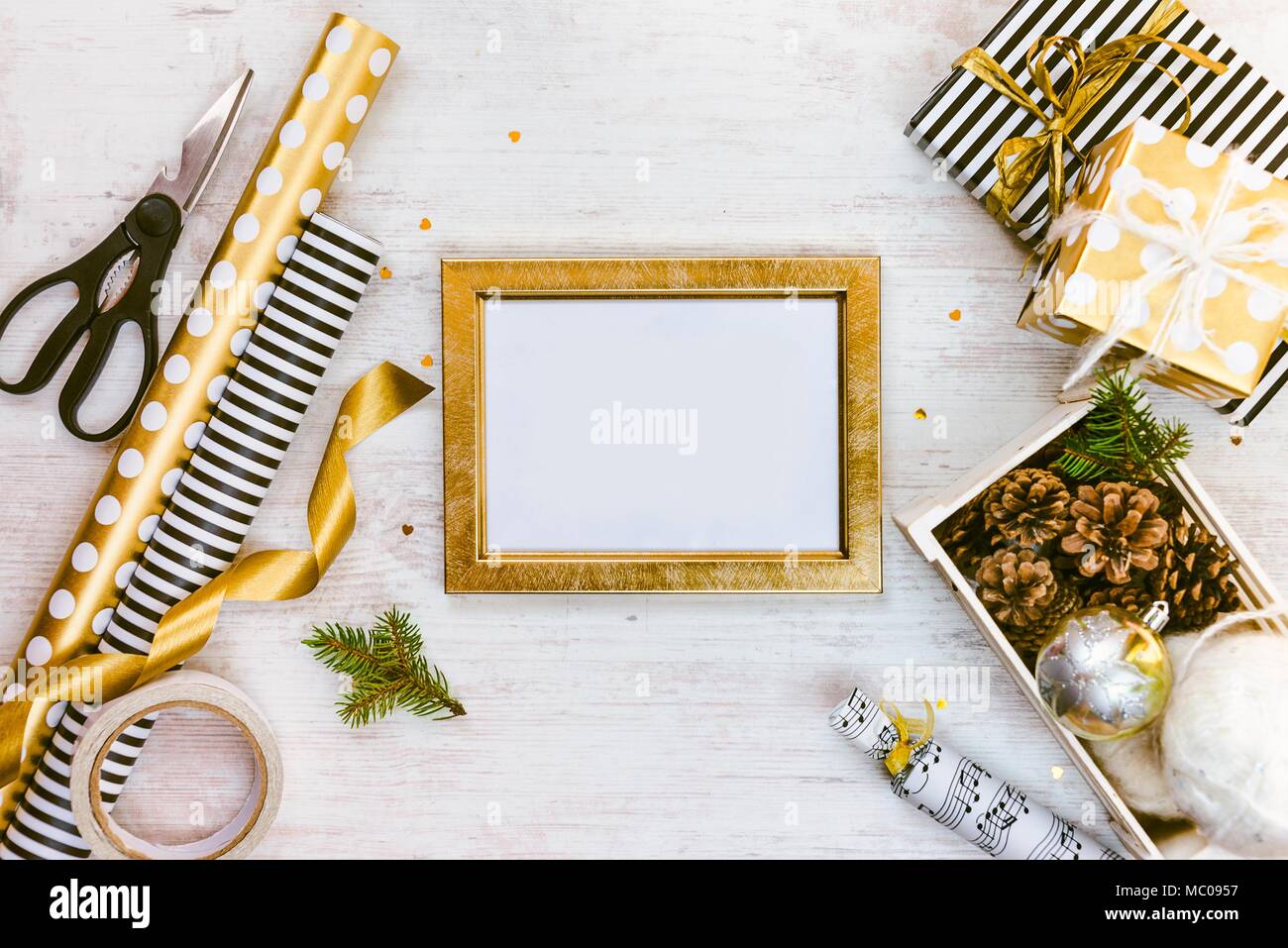 Golden ptoto frame, gift boxes, a crate full of pine cones and ...