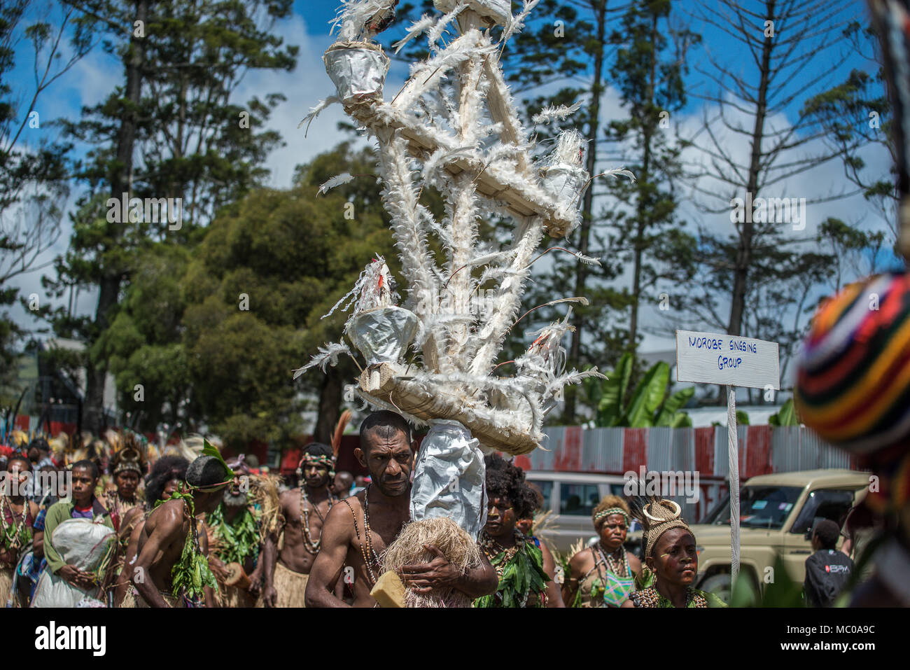 Morobe Sing Sing Group parading with a huge framework decorated with ...