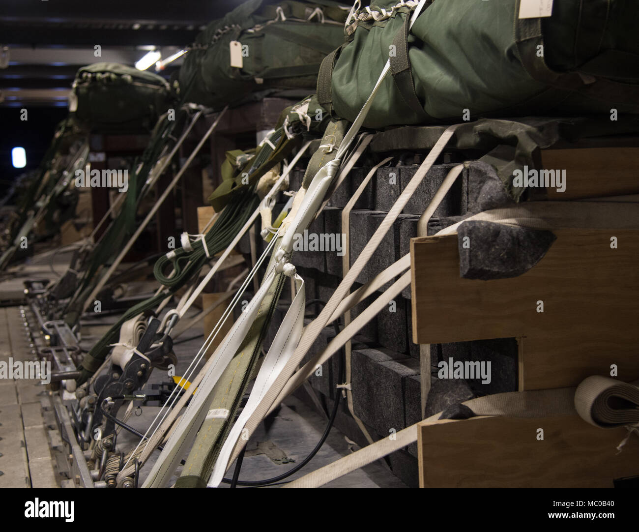 Heavy cargo pallets, weighing as much as 3,400 pounds, are packed with ...