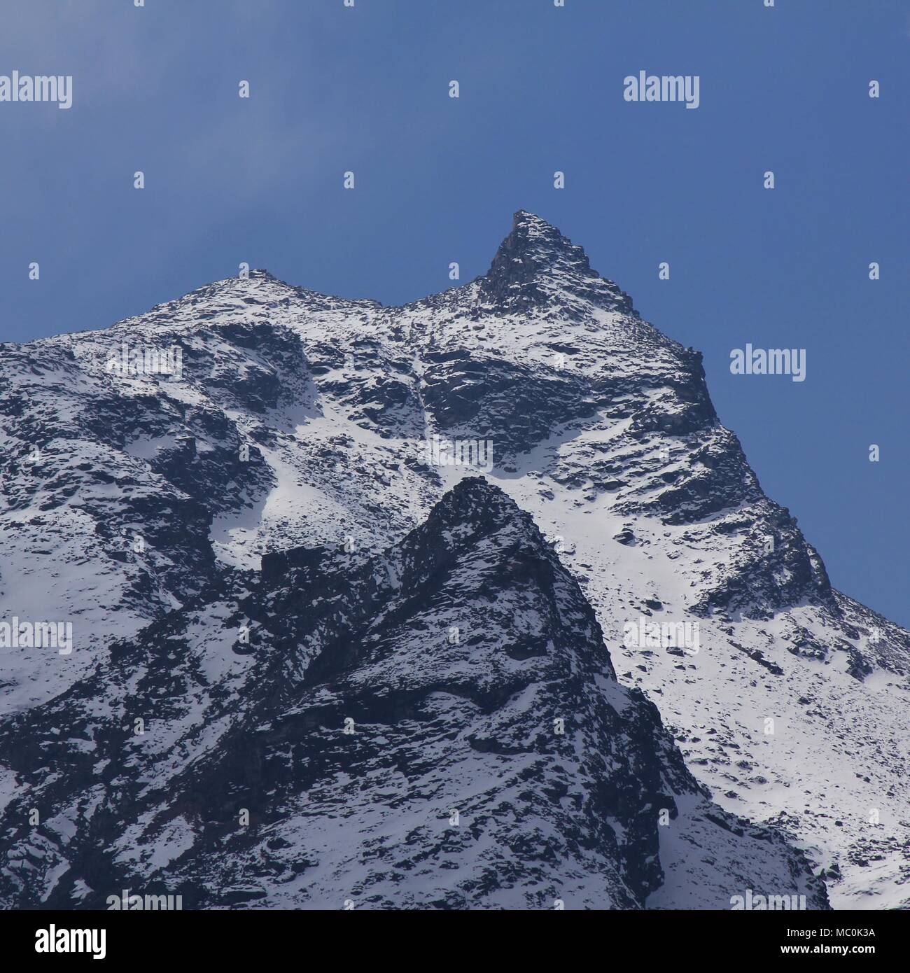 Twin peaks covered by snow. Mountains of the Langtang Himal range ...