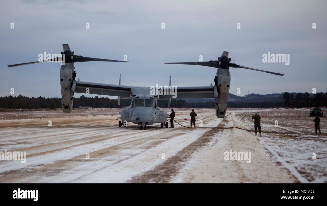 U.S. Marines with Marine Wing Support Squadron 271 refuel an MV-22 ...