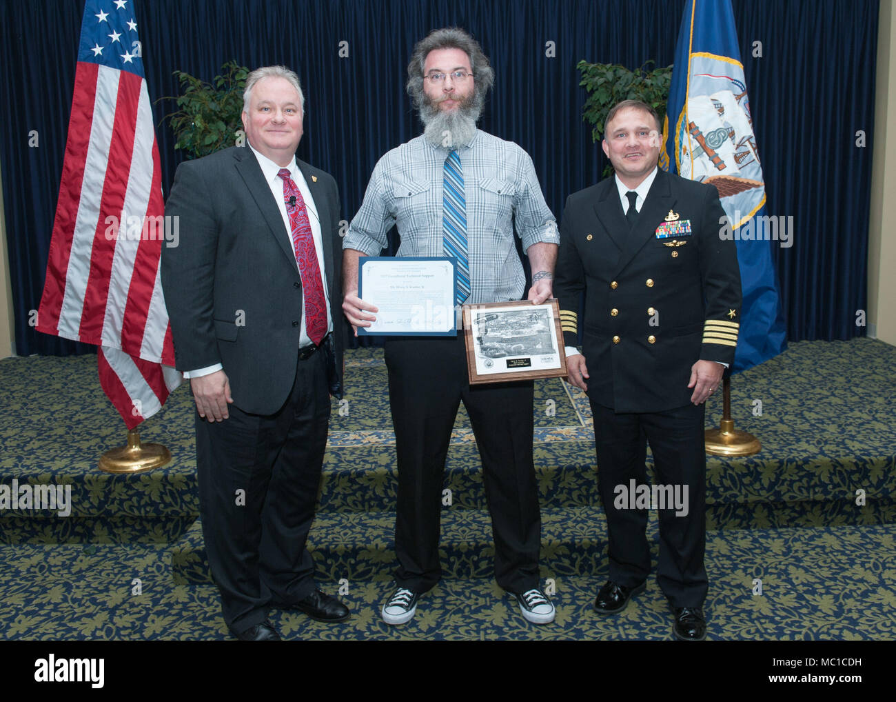 PANAMA CITY, Florida - Harry Kantor, center, receives a 2017 ...
