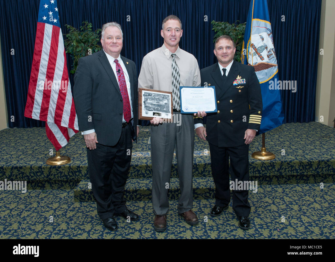 PANAMA CITY, Florida - Michael Cylke, center, receives the 2017 ...