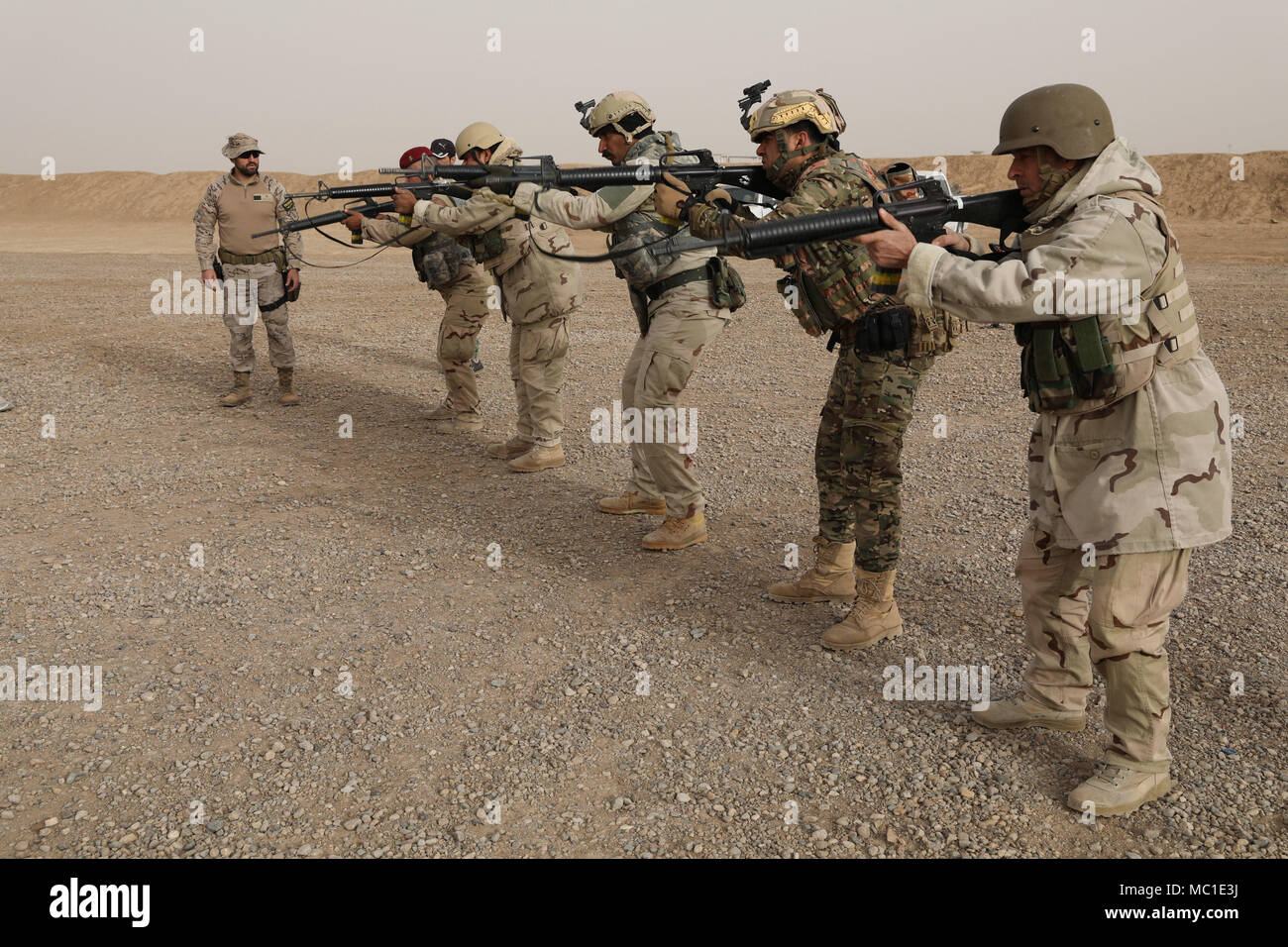 A Spanish instructor goes over rifle fundamentals and techniques for ...