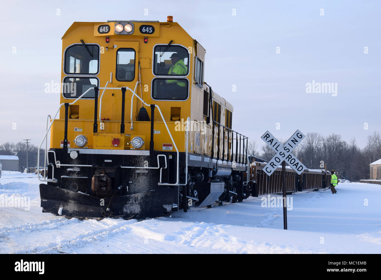 Crane Army rail workers remove ice from rail switches during ...