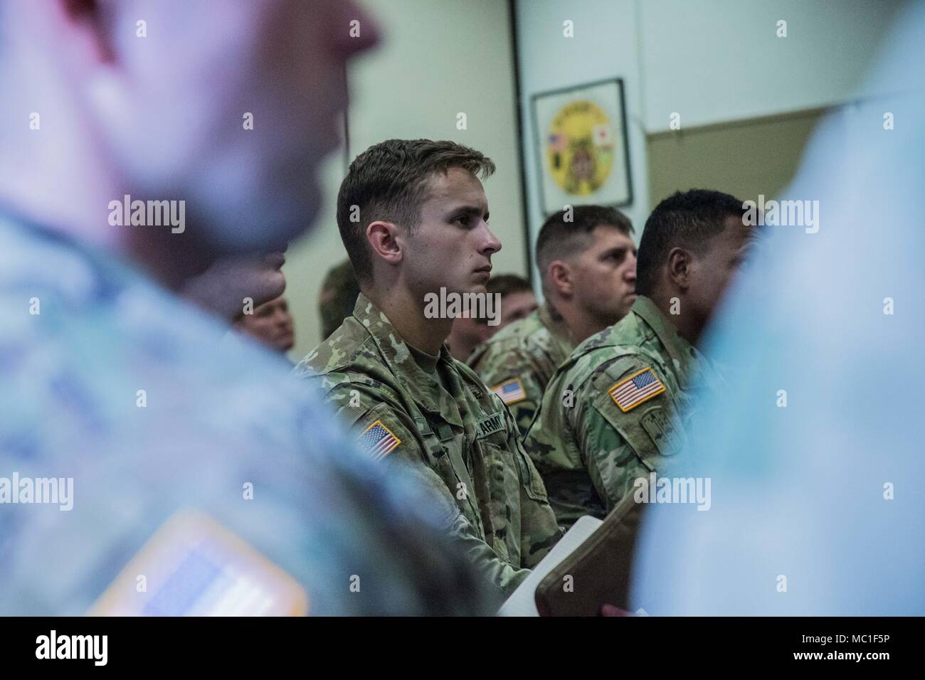 U.S. Army 1st Lt. Ben Morgan listens to retired Lt. Gen. Robert F ...