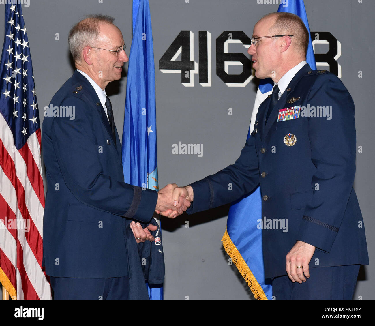 Lt. Gen. Mark Ediger, Surgeon General of the Air Force, shakes hands ...