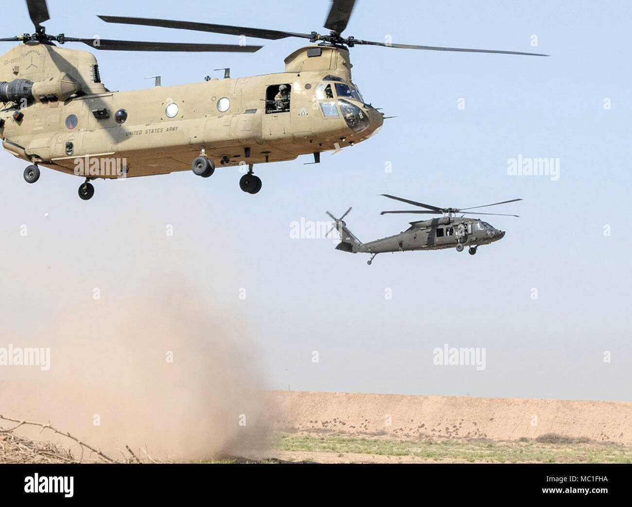 A UH-60M Black Hawk helicopter, right, and a CH-47 Chinook helicopter ...