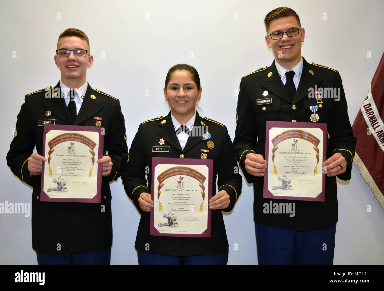 Pfcs. Austin Lewis, Charlene Perez and Jake Serrano-McEwen pose with ...