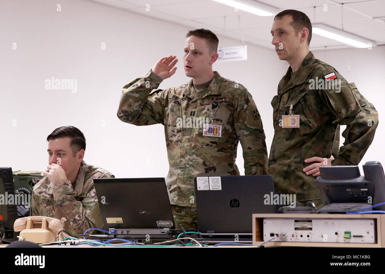 U.S. Army Soldiers, and a Polish Soldier, work together as they ...