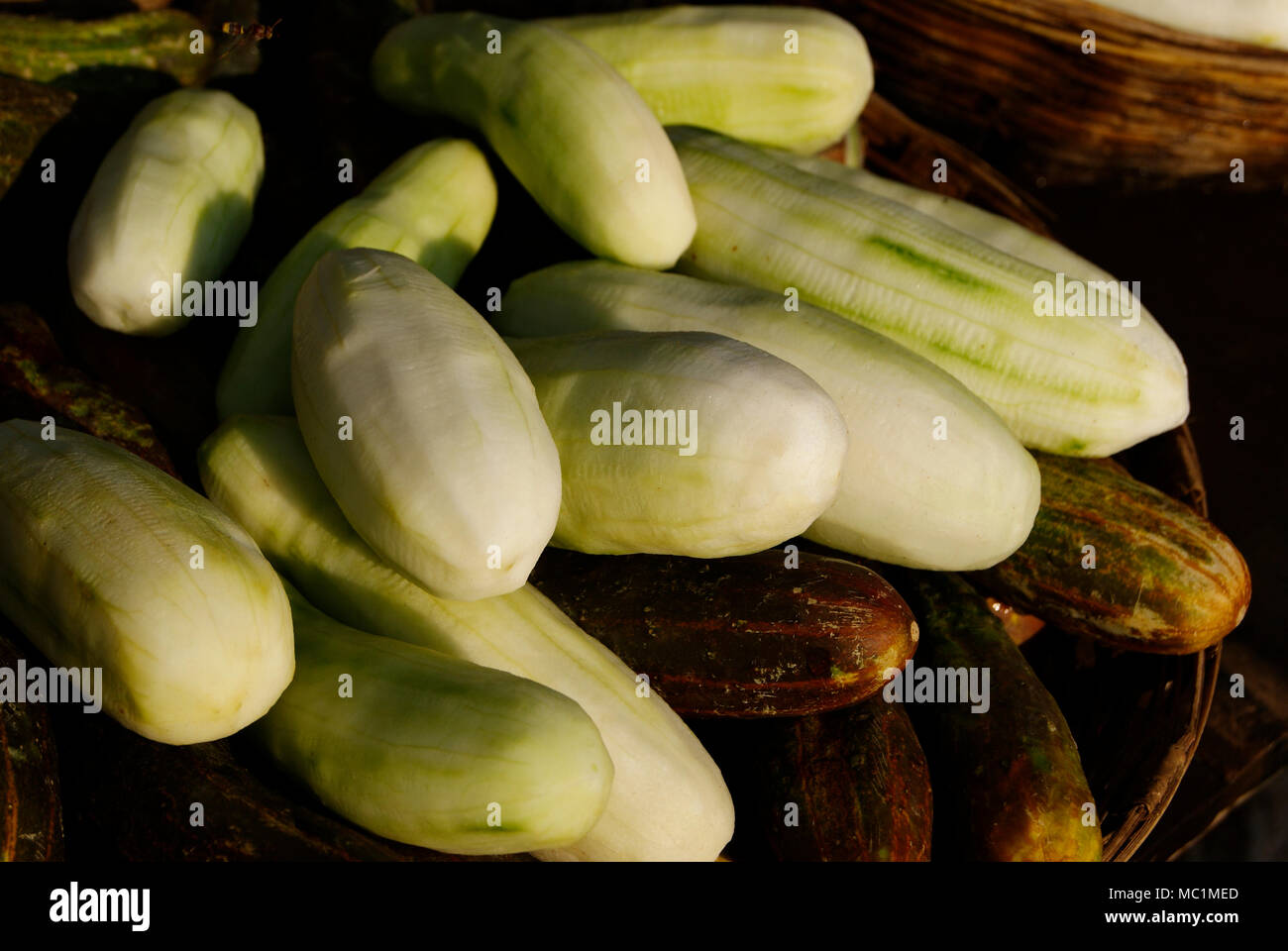 Close up image of raw cucumber with and without skin for sale in india ...