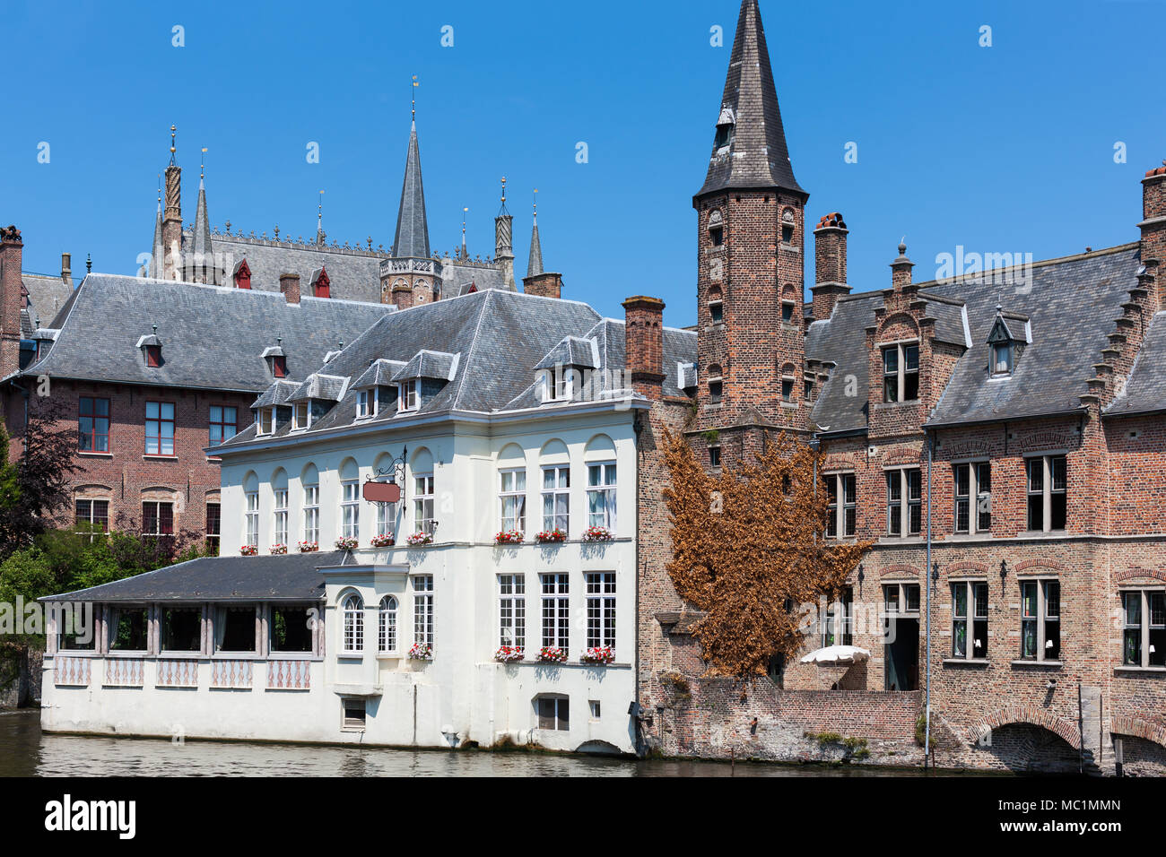 Riverside architecture of contrasting styles in Bruges, Brugge, Belgium ...