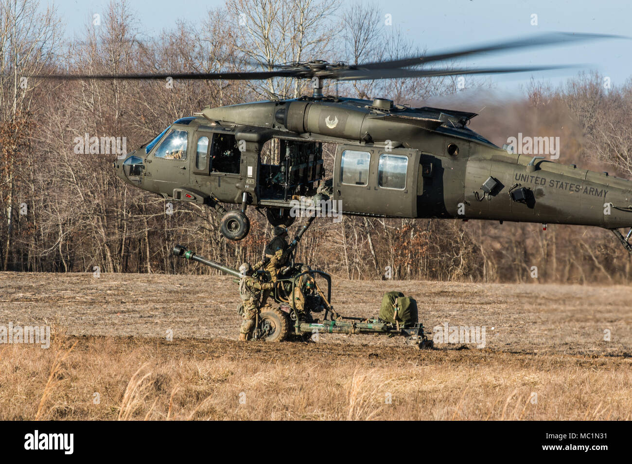 Artillerymen from B Battery, 3rd Battalion, 320th Field Artillery Regiment, 101st Airborne ...