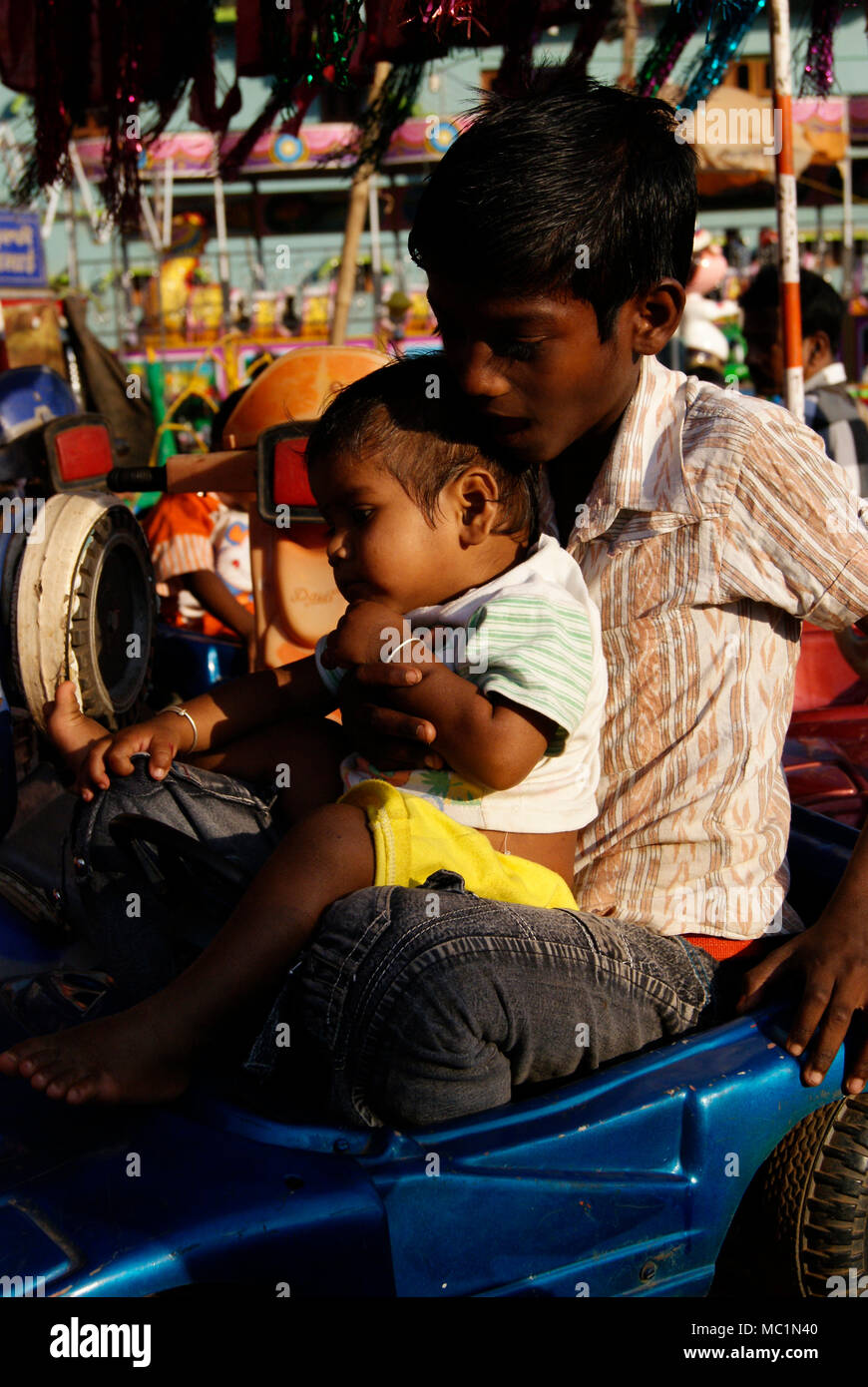 A boy child enjoying car ride with his younger brother in kerala India ...
