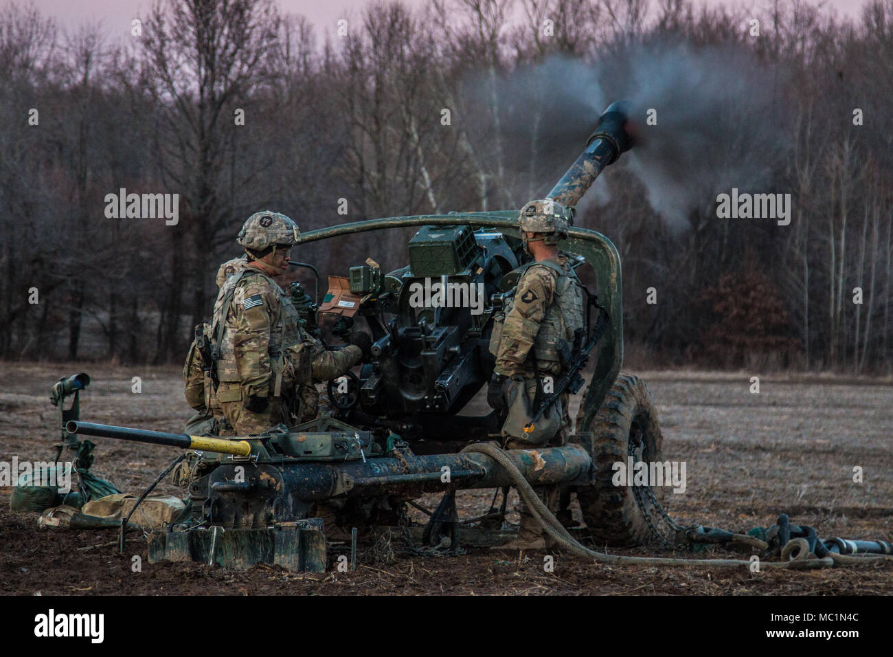 Artillerymen from B Battery, 3rd Battalion, 320th Field Artillery Regiment, 101st Airborne ...