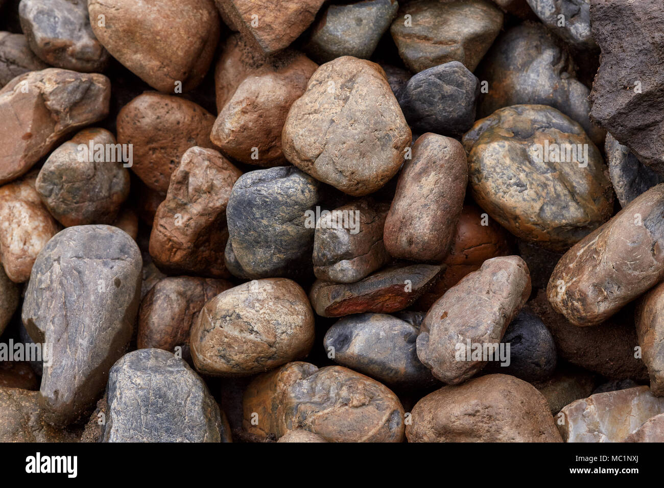Many dark pebble hi-res stock photography and images - Alamy