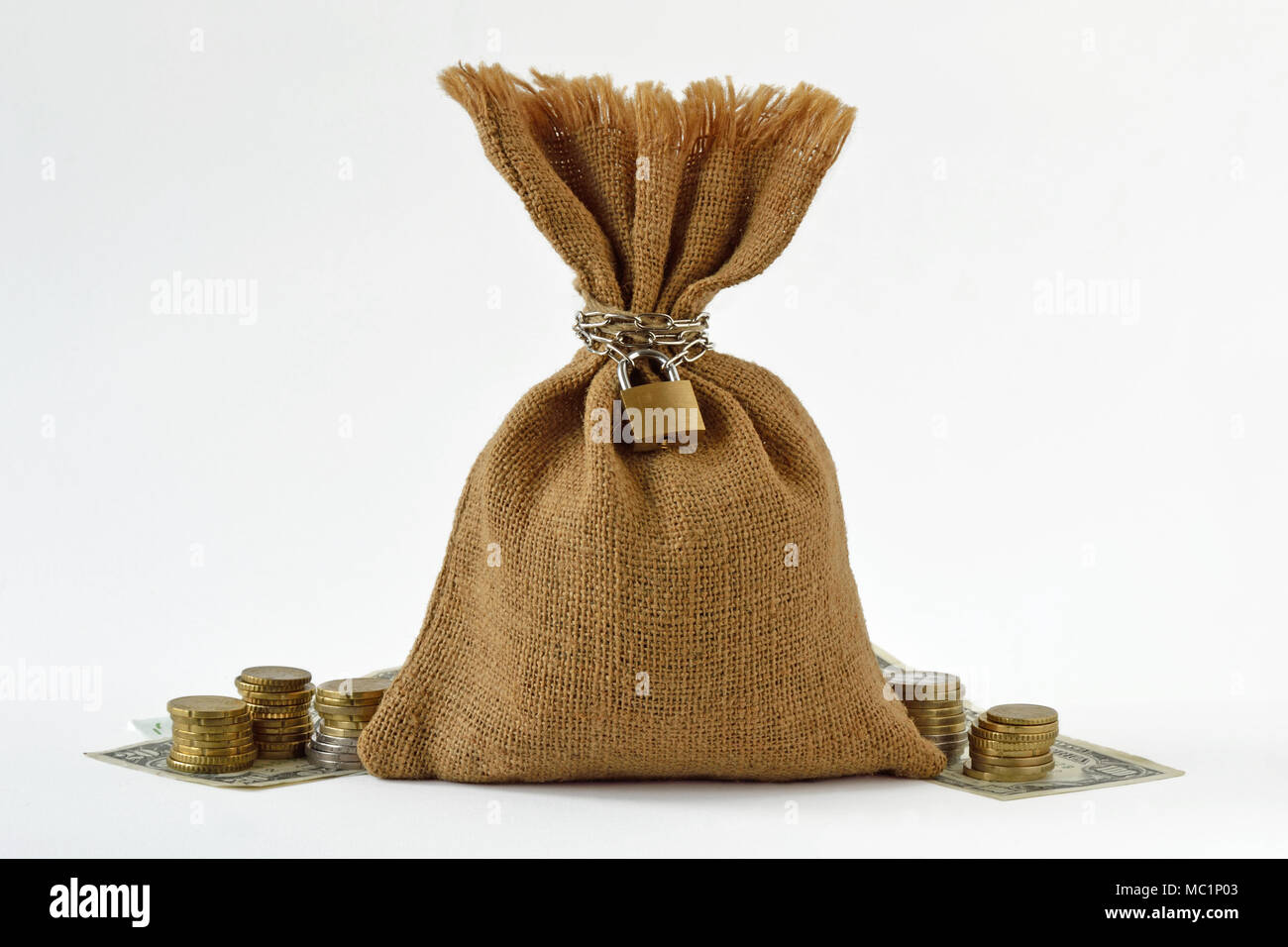 Money bag with padlock and chain, banknotes and coins - Saving money ...