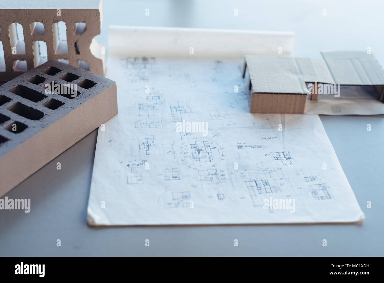 Architect desk with handdrawing sketches and brick blocks Stock Photo ...