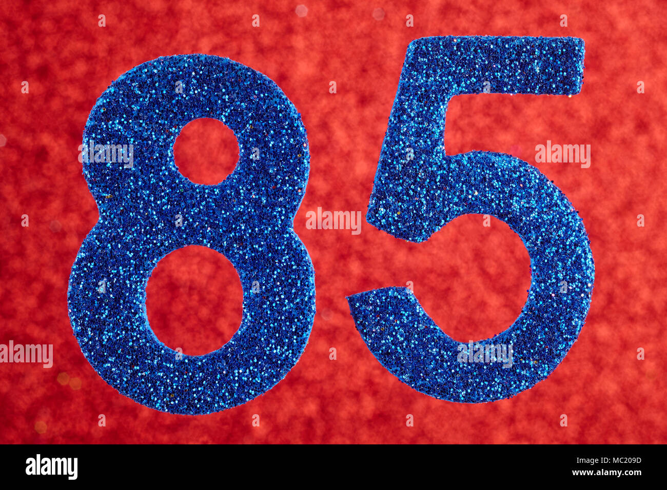 Number eighty-five blue color over a red background. Anniversary ...