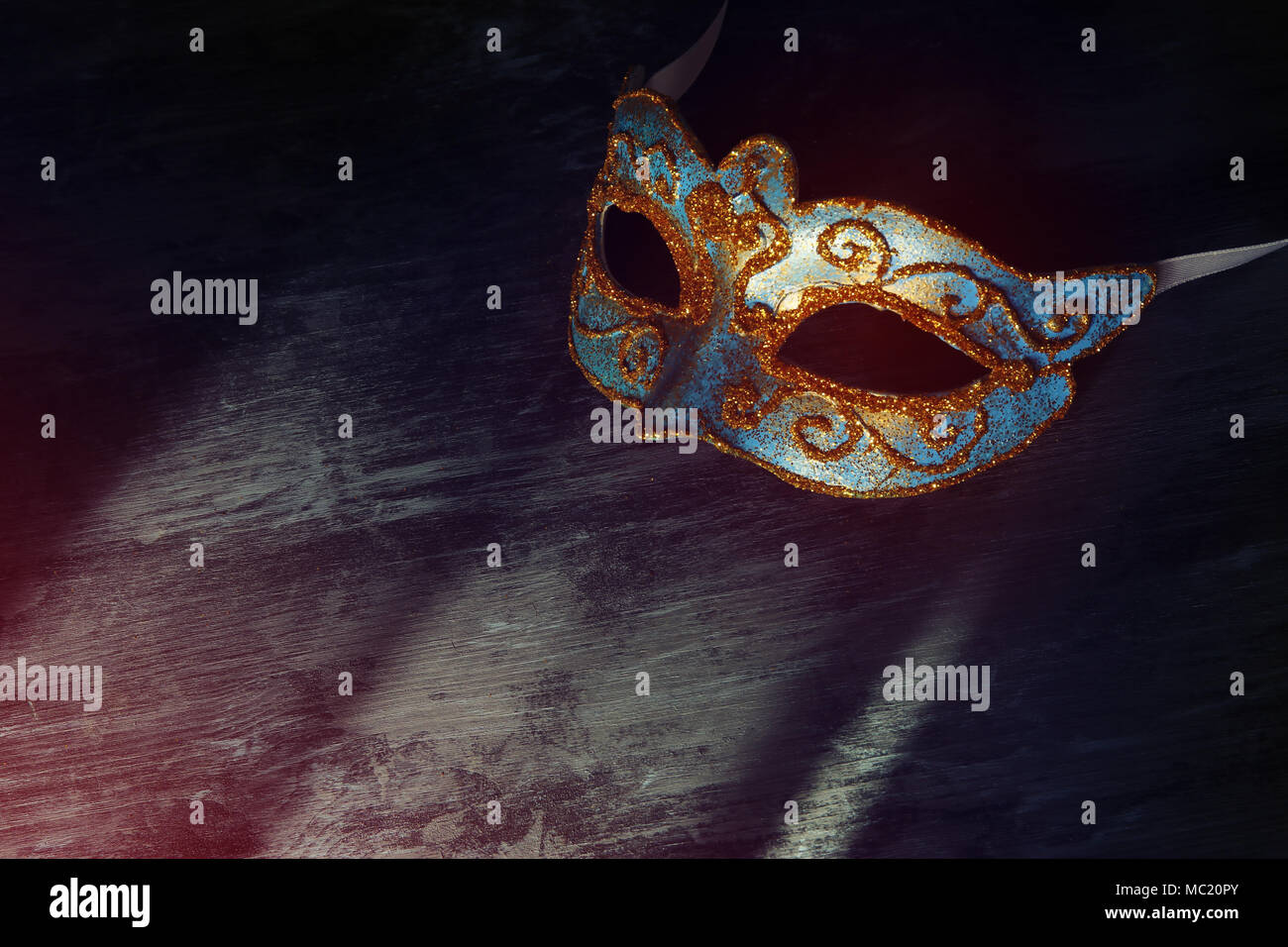Image of elegant blue and gold venetian, mardi gras mask over black ...