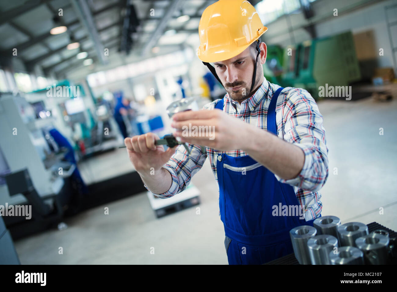 Supervisor doing quality control and pruduction check in factory Stock ...