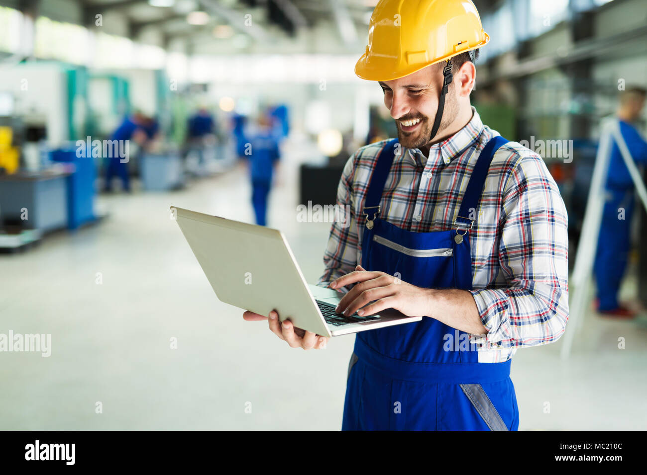 industrial factory employee working in metal manufacturing industry ...