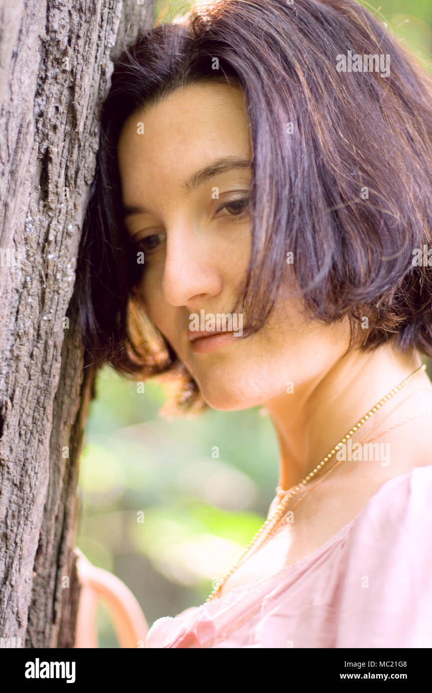 Woman with old tree hi-res stock photography and images - Alamy