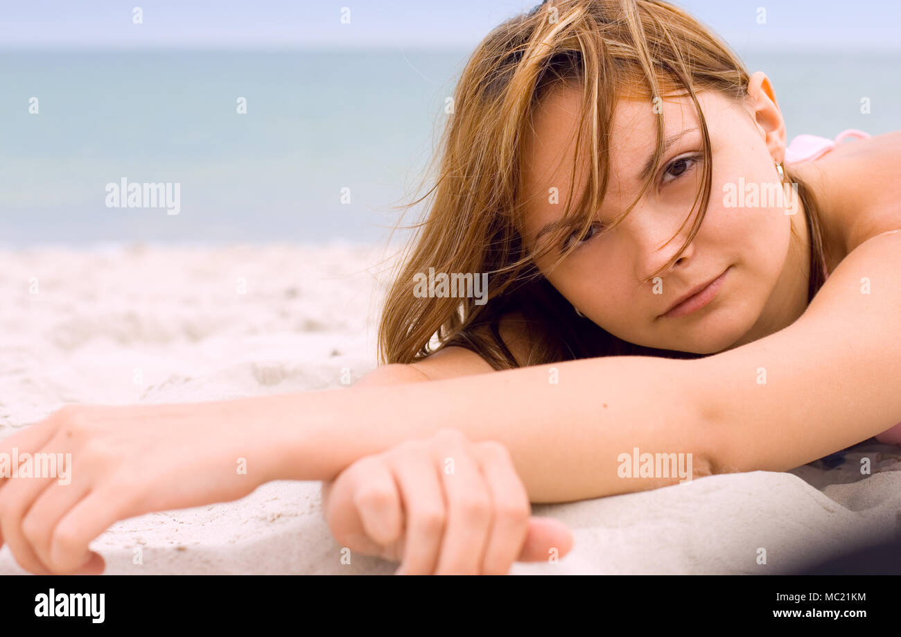 attractive woman lying on the beach Stock Photo - Alamy