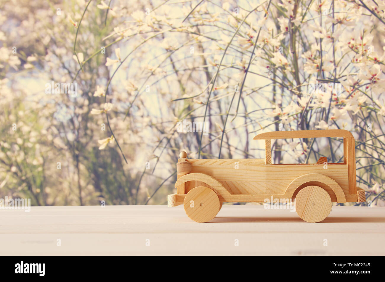 Vintage wooden toy car over wooden table. Nostalgia and simplicity ...