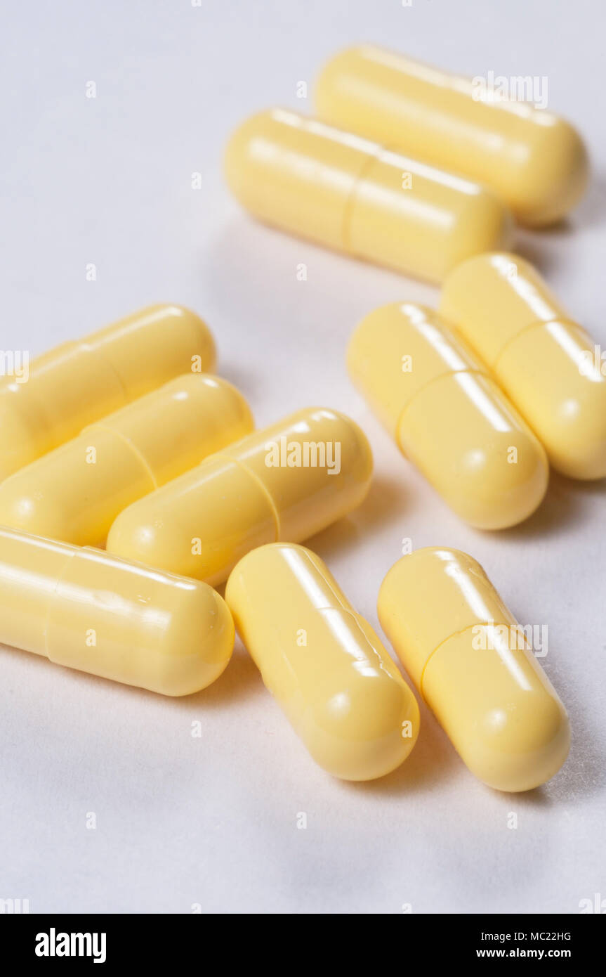 Capsules of antibiotic over light background, macro shot Stock Photo ...