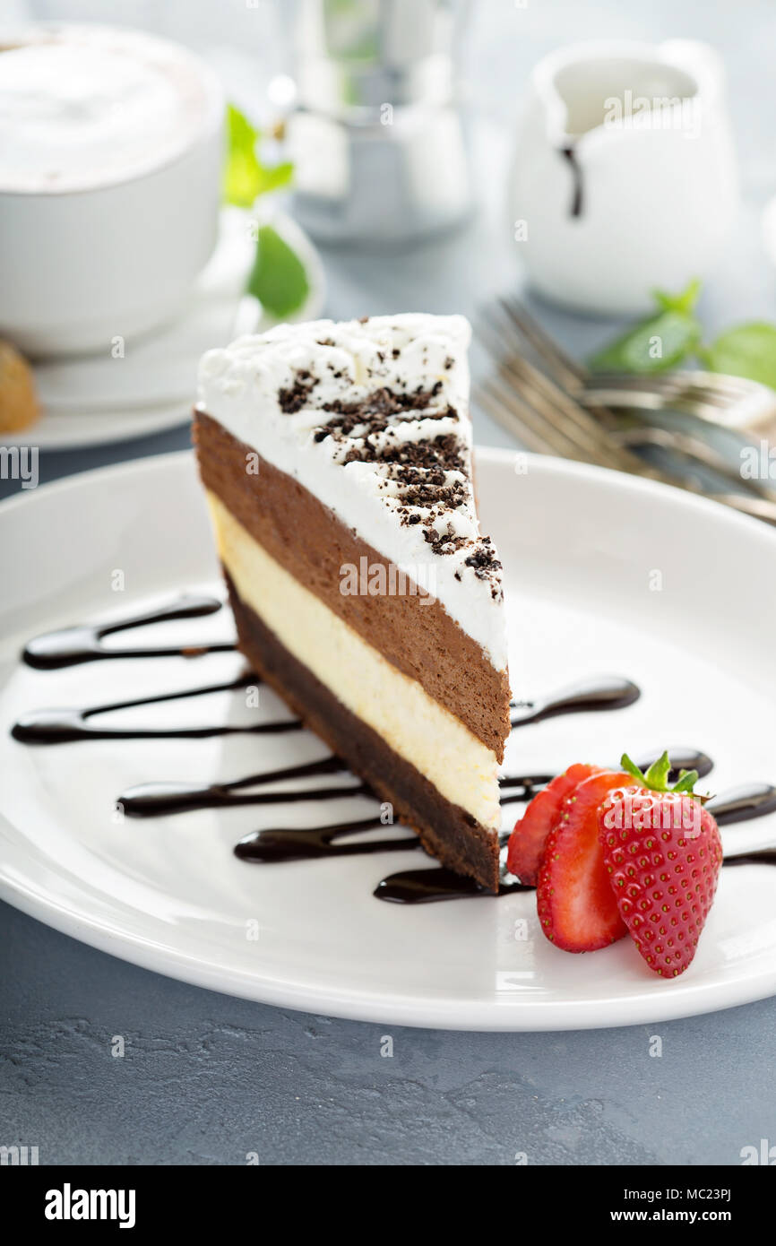 Three chocolate layered mousse cake Stock Photo - Alamy