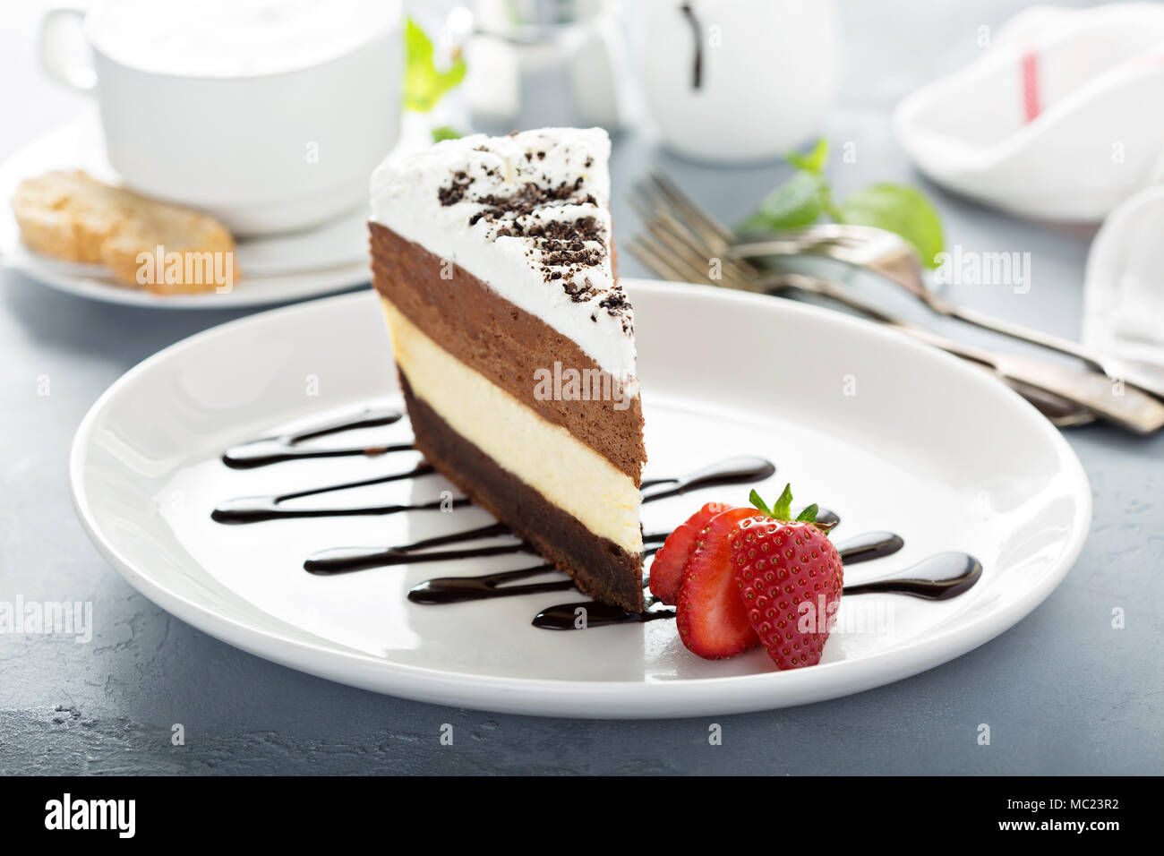 Three chocolate layered mousse cake Stock Photo - Alamy
