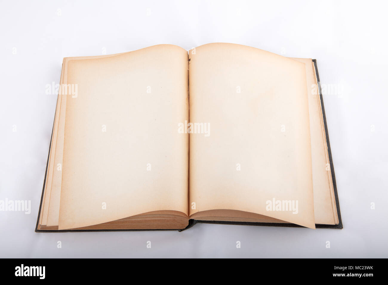 Vintage book blank pages open, on white cloth background with text ...