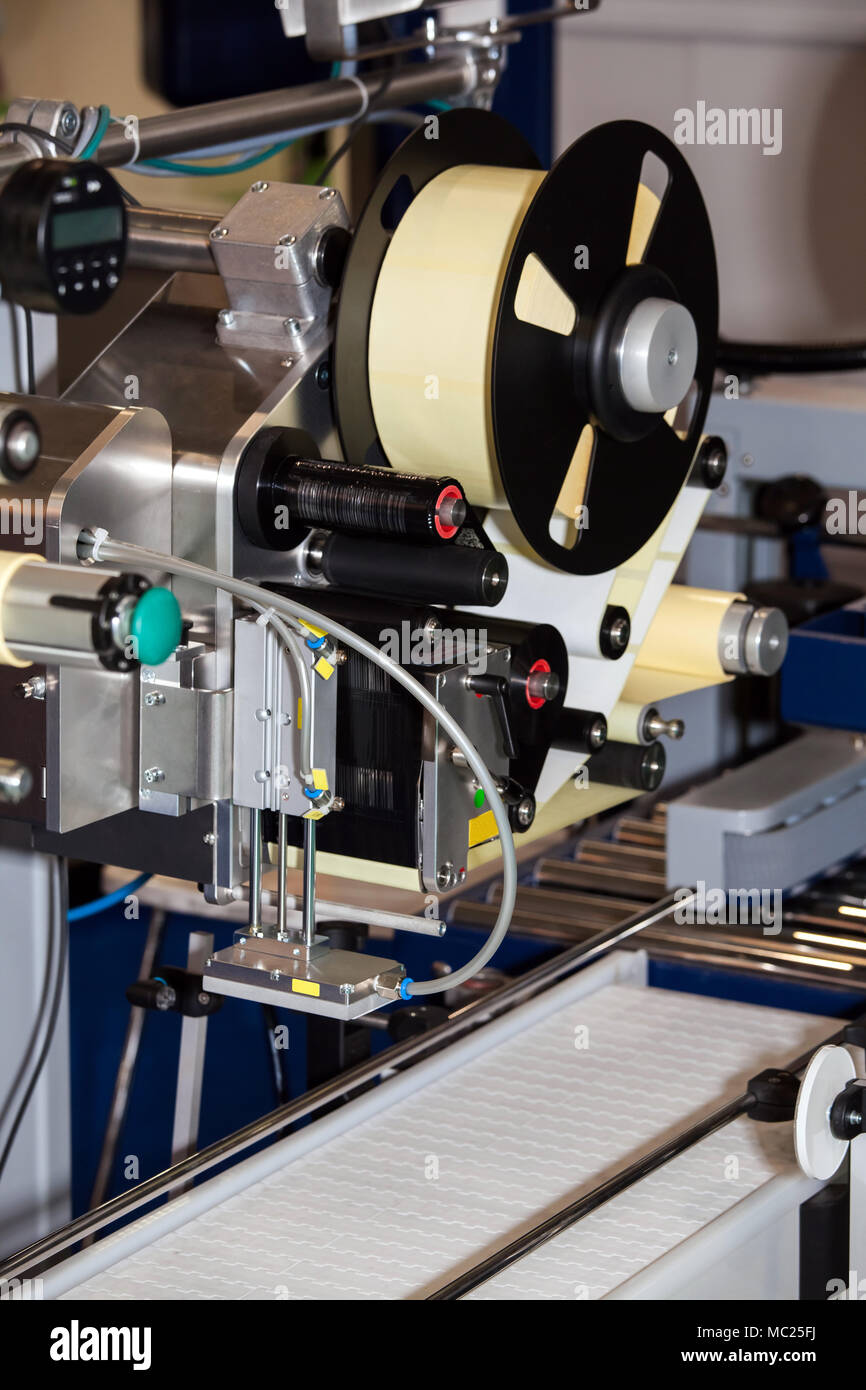 Automatic labeling machine Stock Photo - Alamy