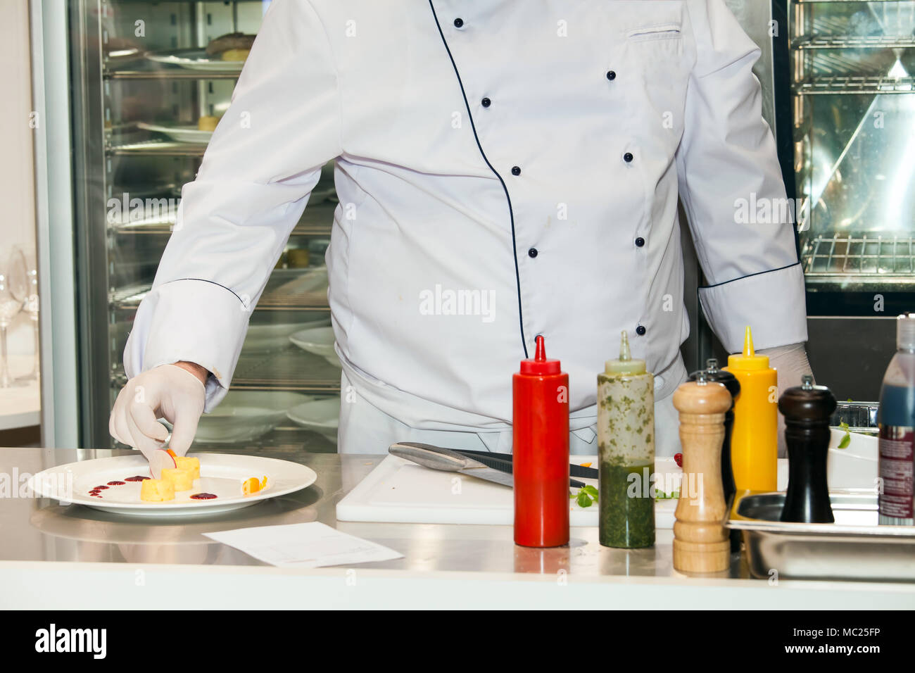 Professional cook preparing meal hi-res stock photography and images ...