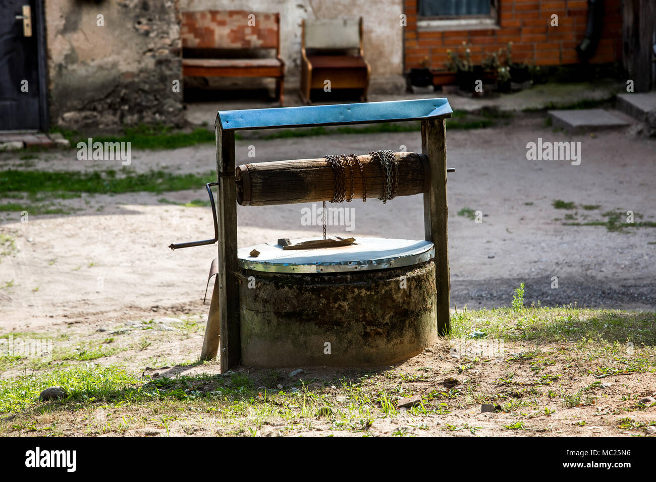 Old stone well with bucket hi-res stock photography and images - Alamy
