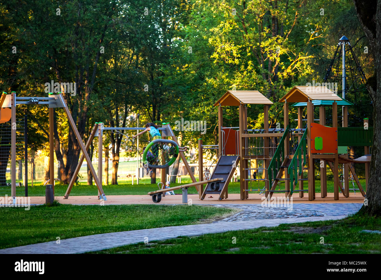Park children playing modern equipment hi-res stock photography and ...