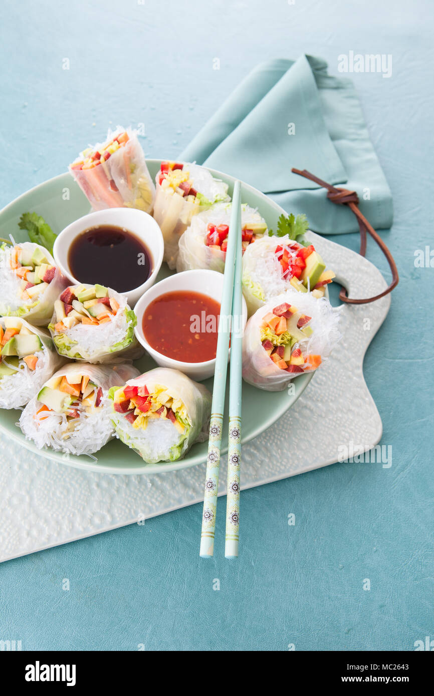 Asian spring rolls with fresh avocado and vegetables Stock Photo - Alamy