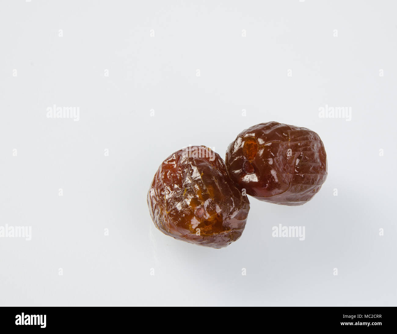 Dried preserved. Sweet syrup monkey apple or Chinese date on the ...