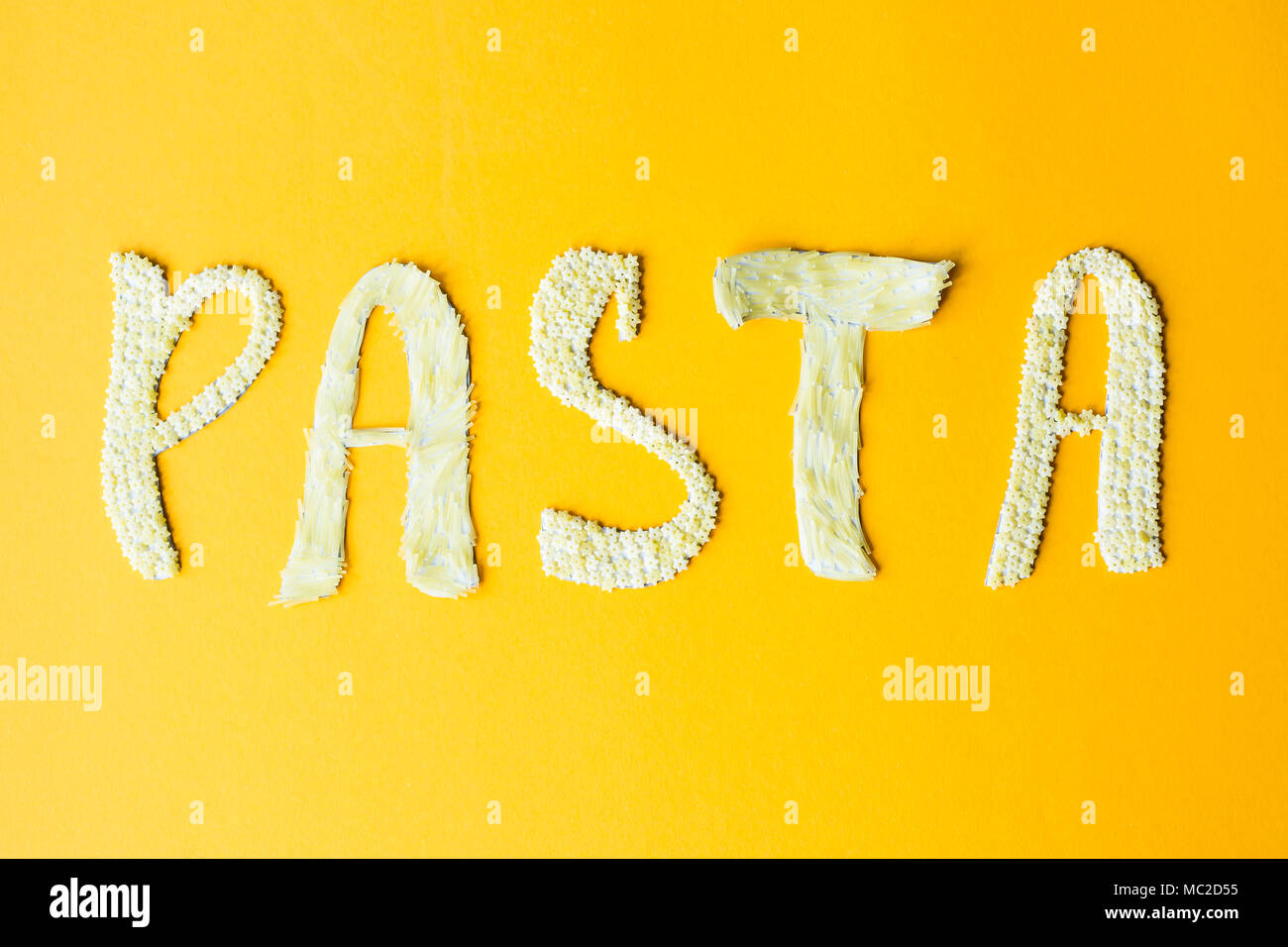 The word pasta is laid out in voluminous letters from small raw ...