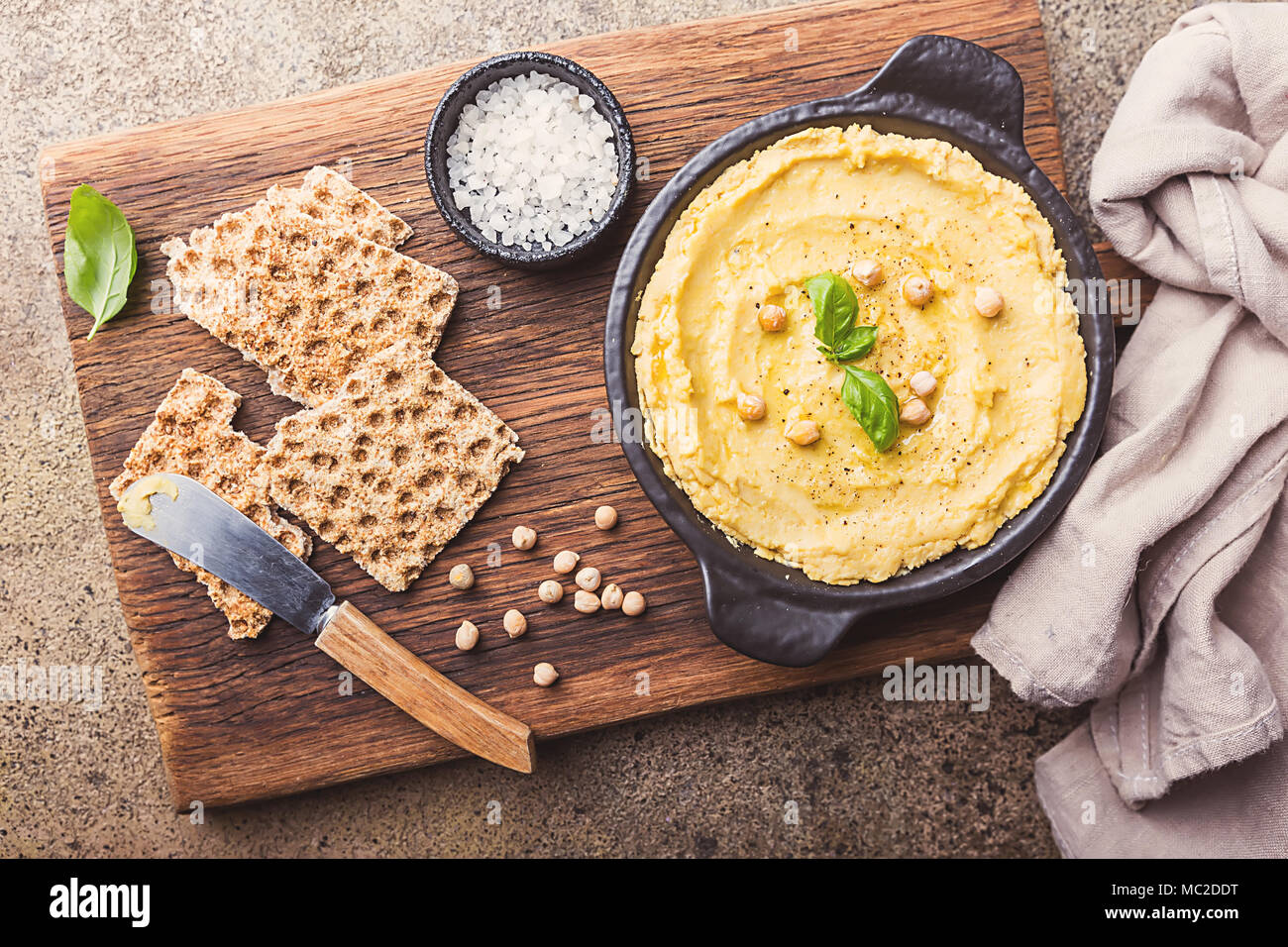 Healthy Homemade Creamy Hummus with Olive Oil over stone background ...