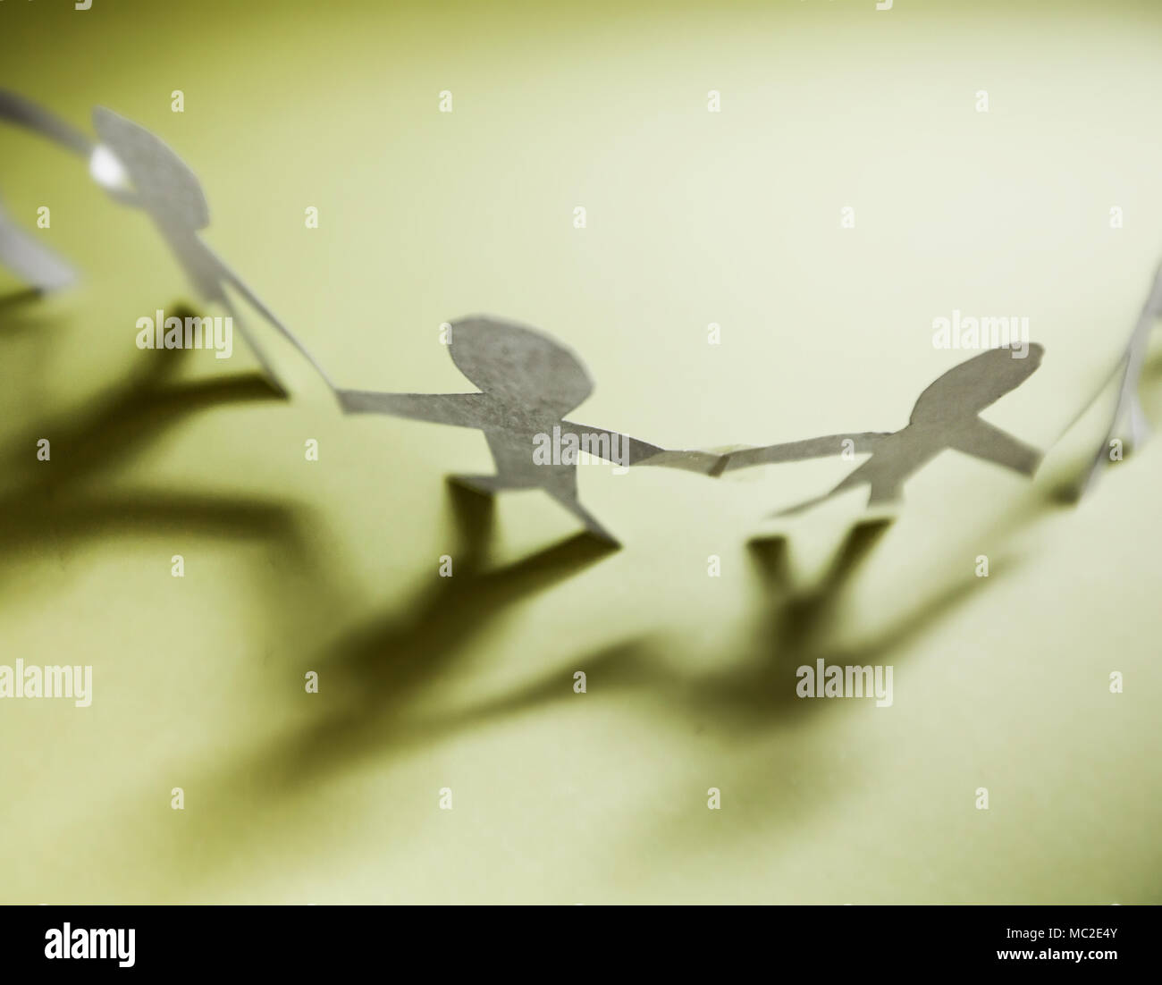 Connected support together, team paper doll people chain Stock Photo ...