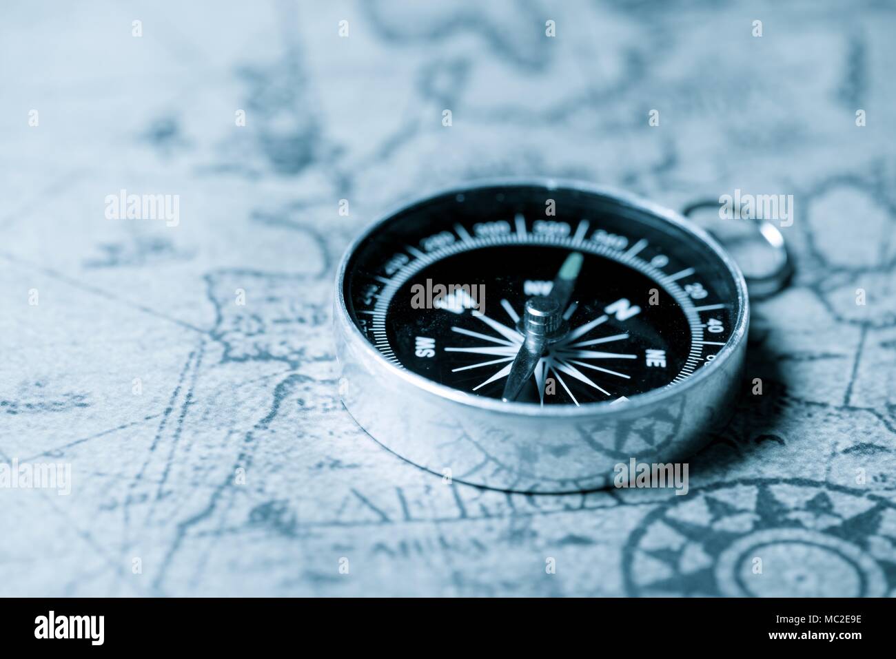 Vintage compass and old navigation map Stock Photo - Alamy