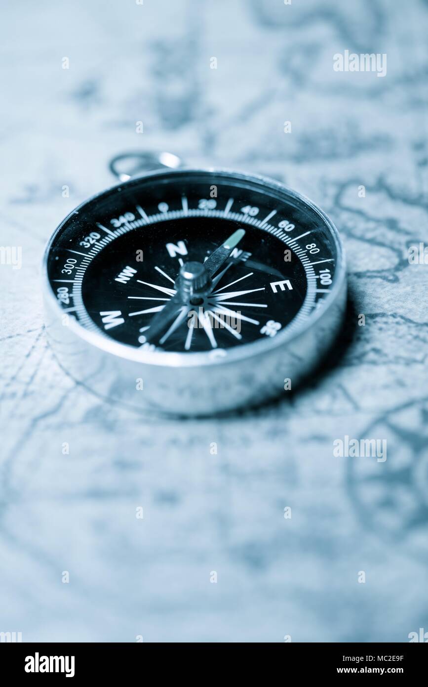 Vintage compass and old navigation map Stock Photo - Alamy