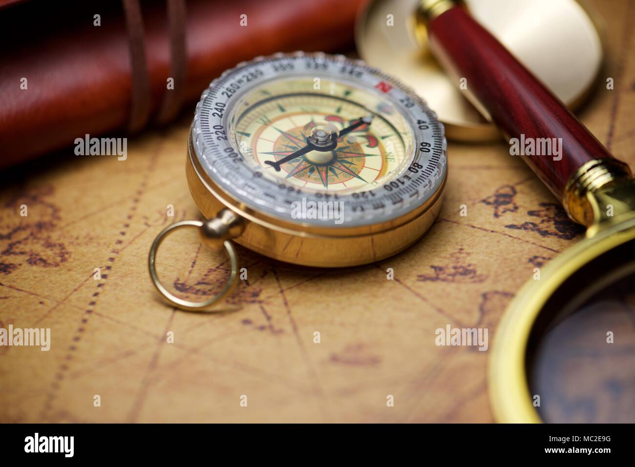 Vintage compass and old navigation map Stock Photo - Alamy
